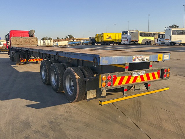 1990 Hendred Frauhauf Tri-axle Flat Deck 14M Trailer | Impala Truck Sales